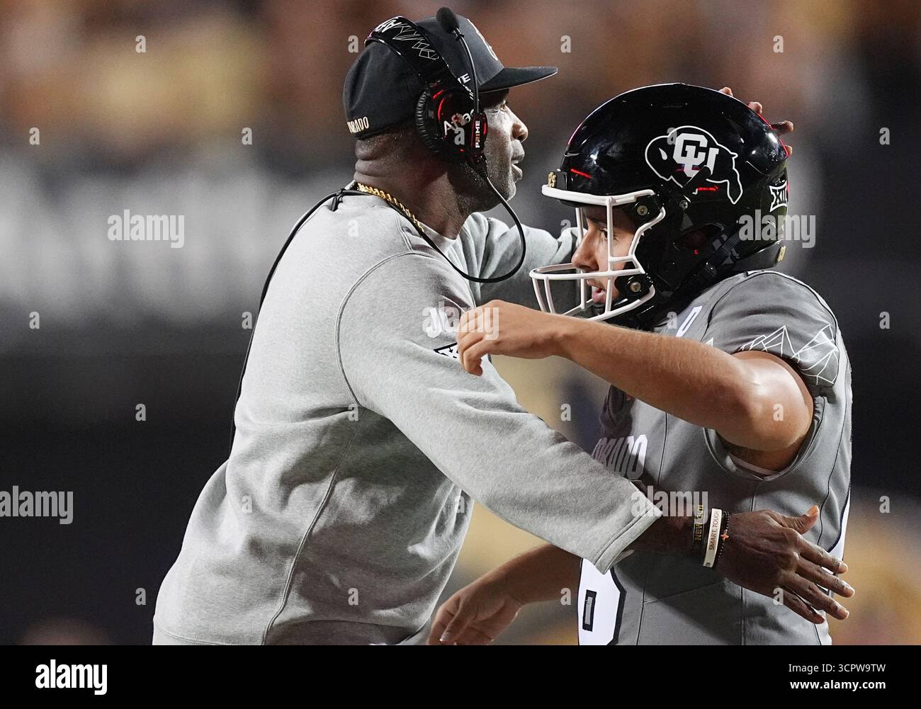 Colorado head coach Deion Sanders, left, hugs place kicker Alejandro ...