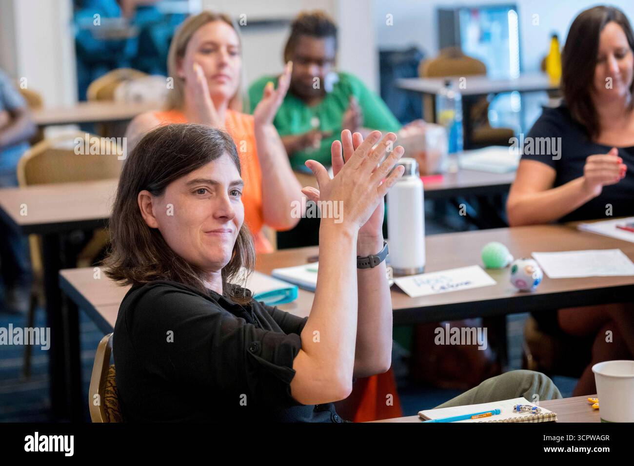 U.S. Navy Cmdr. Emily "Hawking" Shilling, left, who is suing the Trump ...