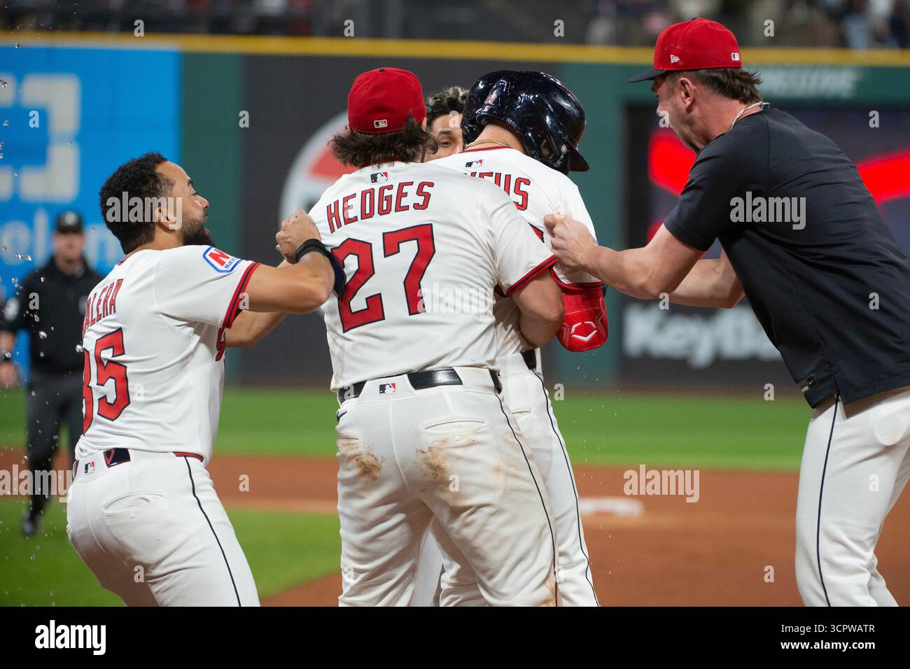 Cleveland Guardians' George Valera, left, Austin Hedges (27) and ...