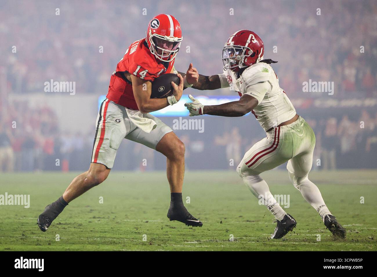 Georgia quarterback Gunner Stockton (14) runs with the football against ...