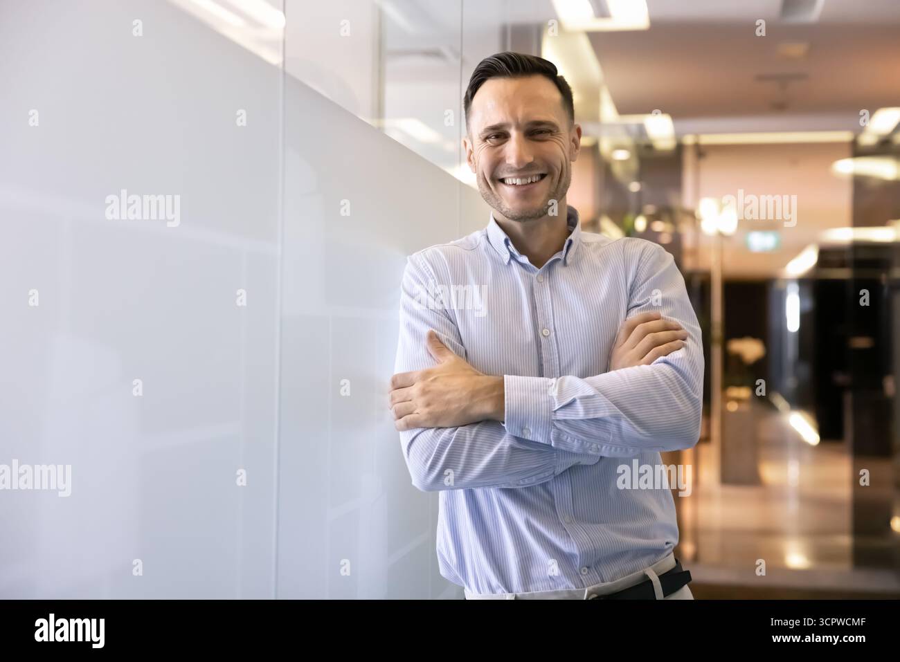 Businessman stands confidently arms hi-res stock photography and images ...