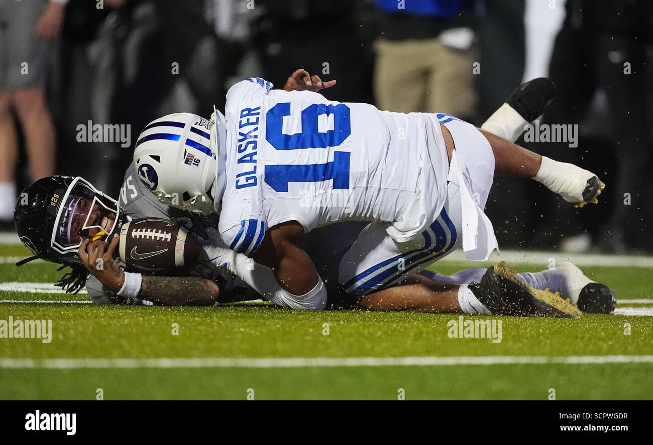 Brigham Young linebacker Isaiah Glasker, top, sacks Colorado ...