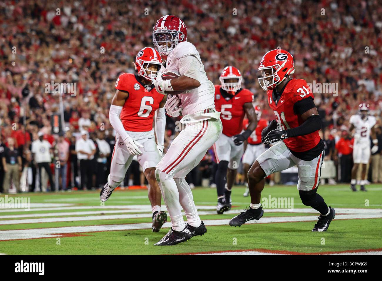 Alabama wide receiver Isaiah Horton, center, scores a touchdown during ...