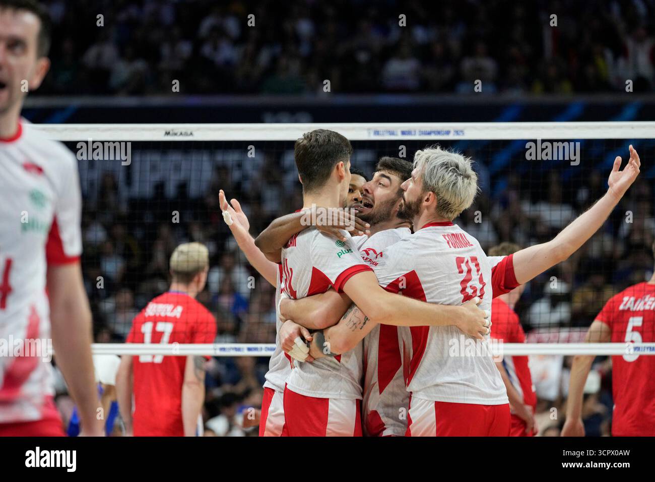 Players from Poland celebrate after winning the bronze medal match for ...