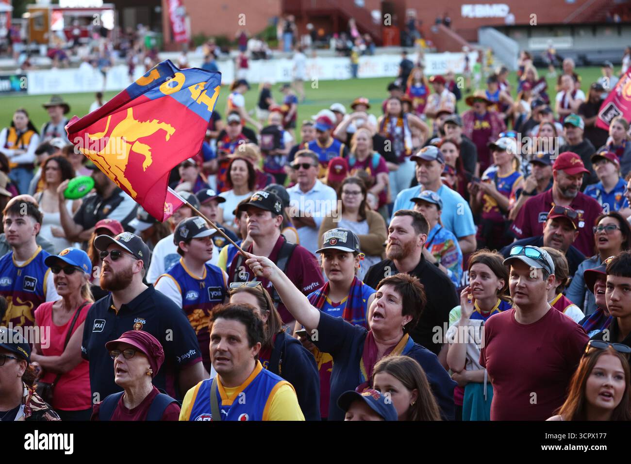 Lions fans celebrate winning the AFL Premiership at Springfield Central ...
