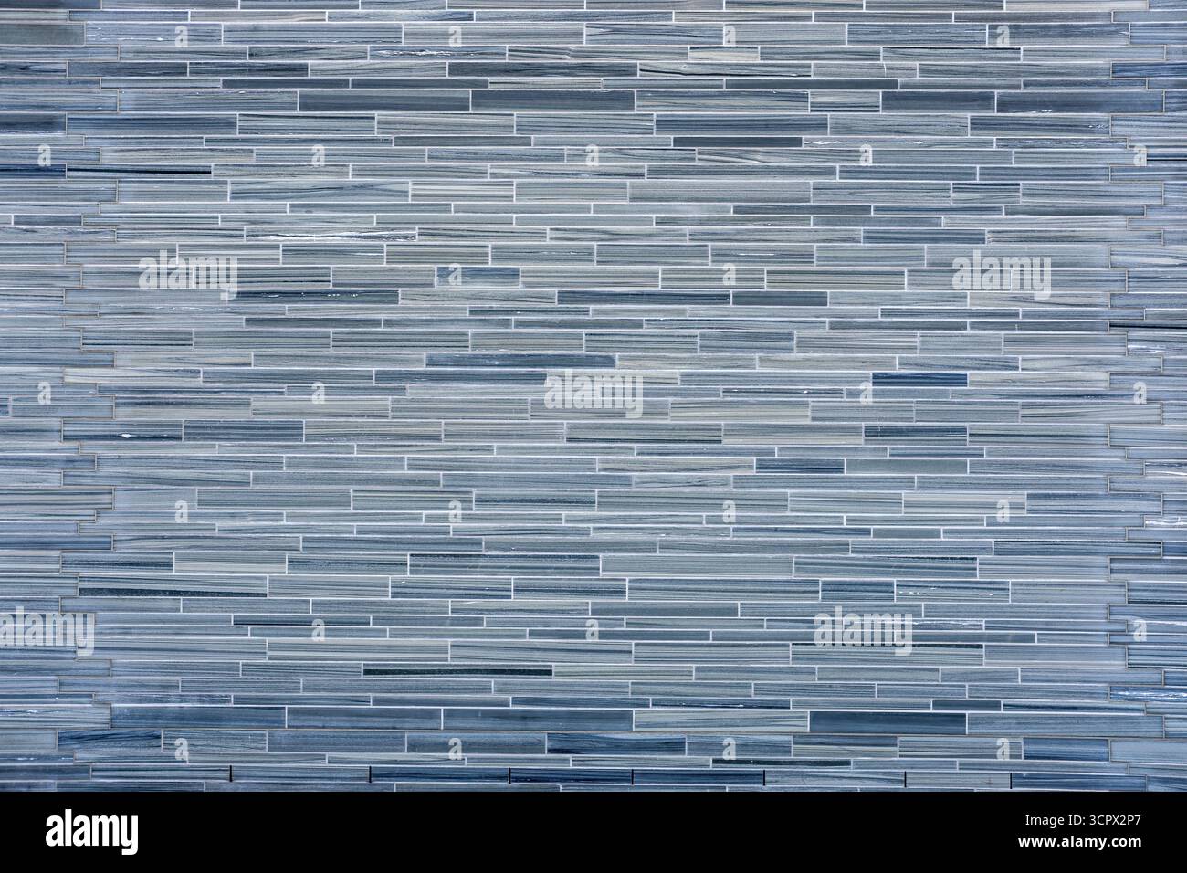 Background from a wall made of small gray stone tiles Stock Photo - Alamy