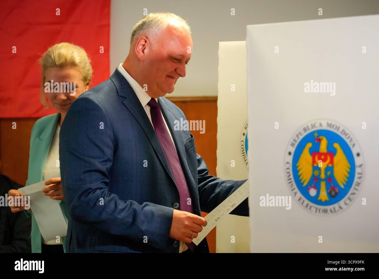 Former Moldovan President Igor Dodon and his wife Galina smile as they ...