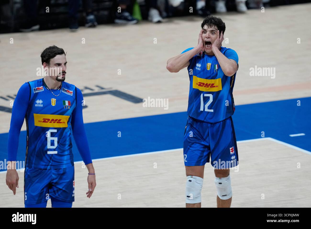 Mattia Bottolo of Italy, right, reacts as teammate Simone Giannelli ...