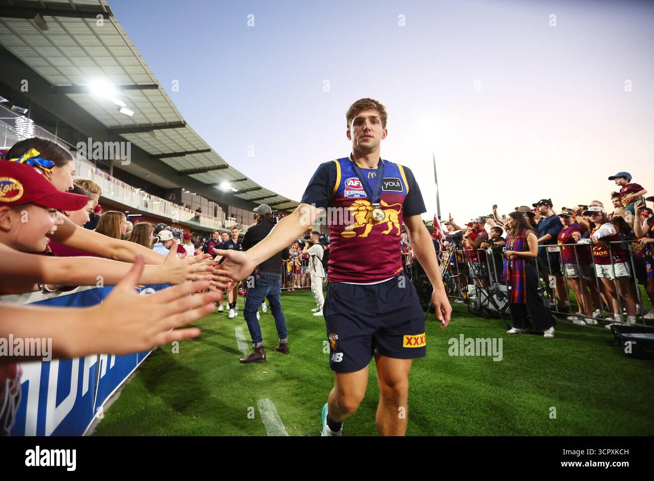 Zac Bailey of the Lions celebrates winning the AFL Premiership at ...