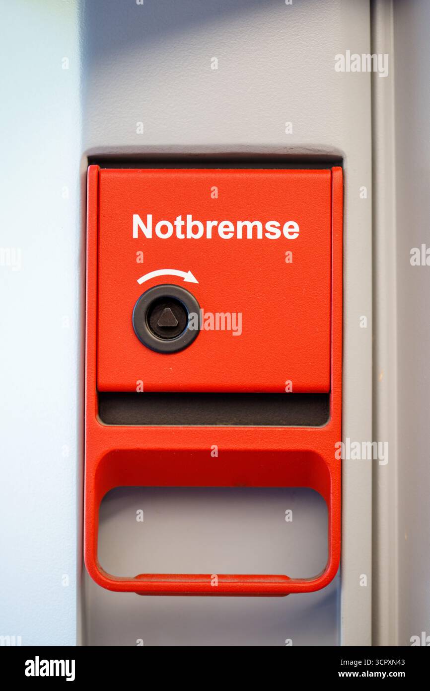 Close-up of a red train emergency brake switch with Notbremse text ...