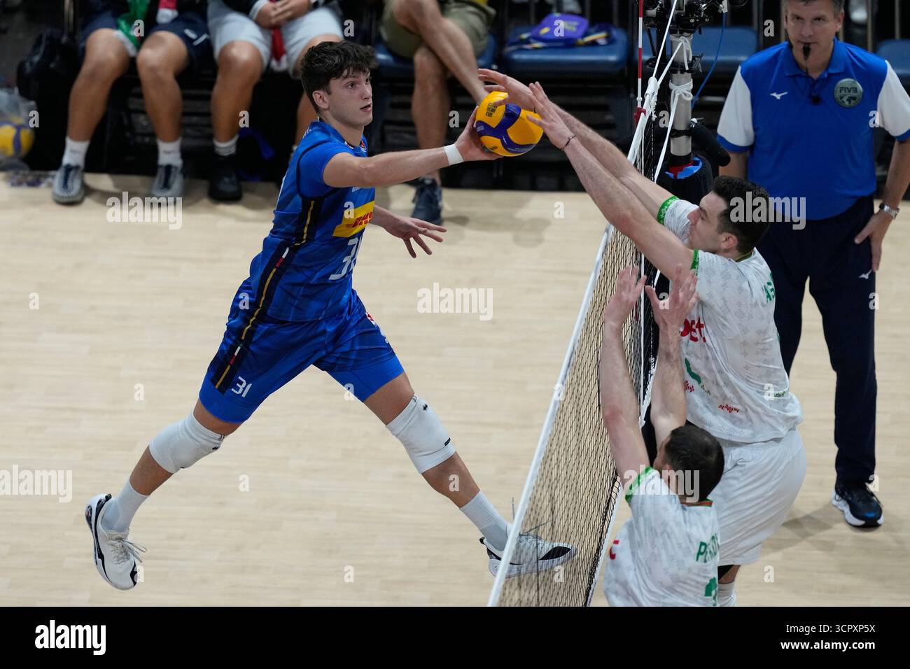 Luca Porro of Italy, left, spikes against Bulgaria during the final ...