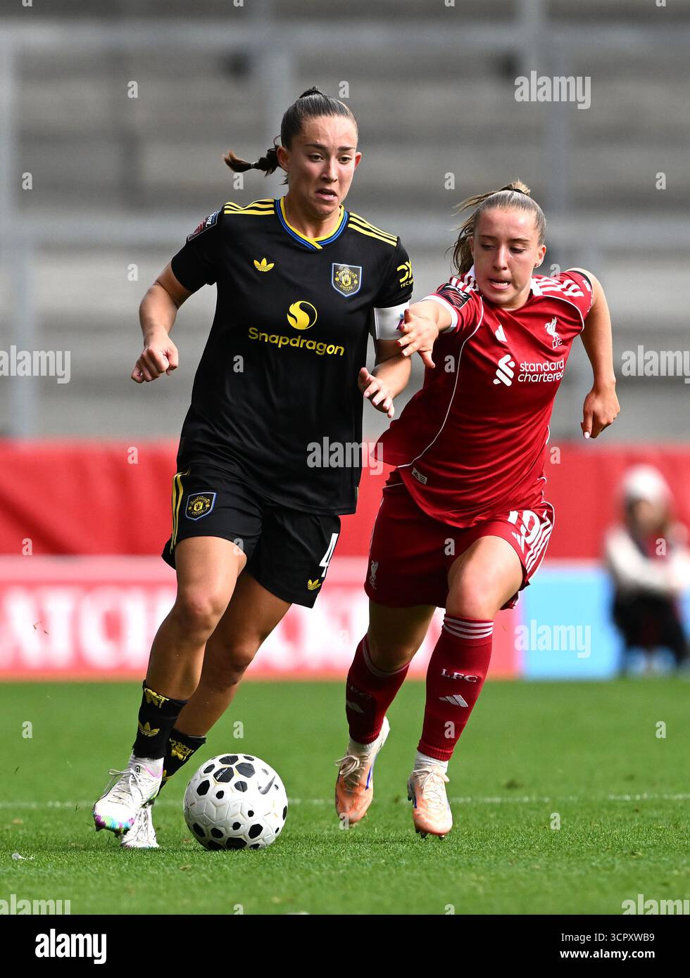 Manchester United's Maya Le Tissier (left) and Liverpool's Kirsty ...
