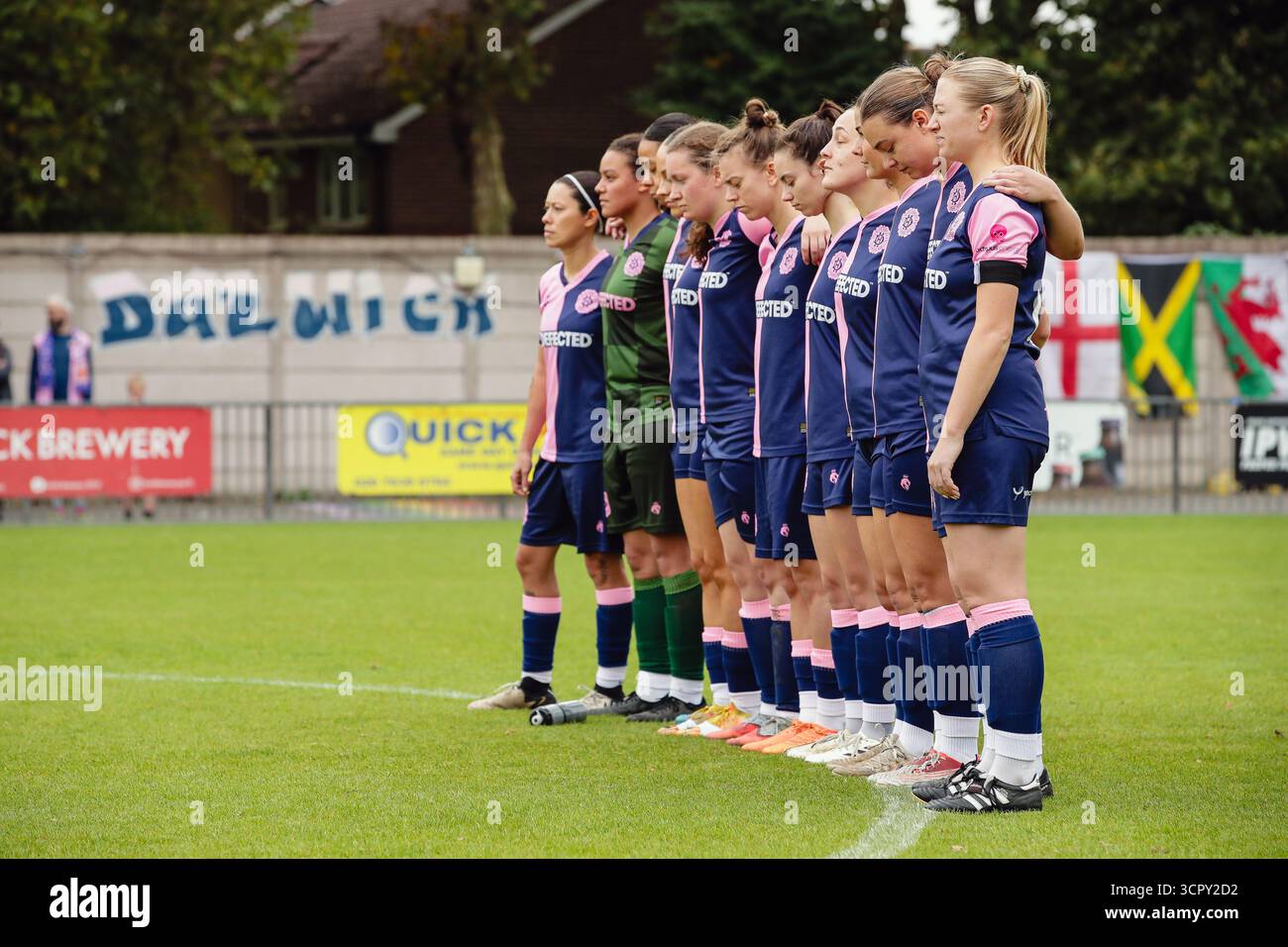 London, UK. 28th September, 2025. Players of Dulwich Hamlet hold a ...