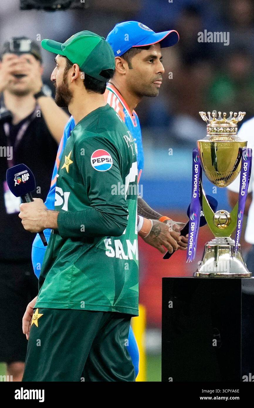 India's captain Suryakumar Yadav, right, and Pakistan's captain Salman ...