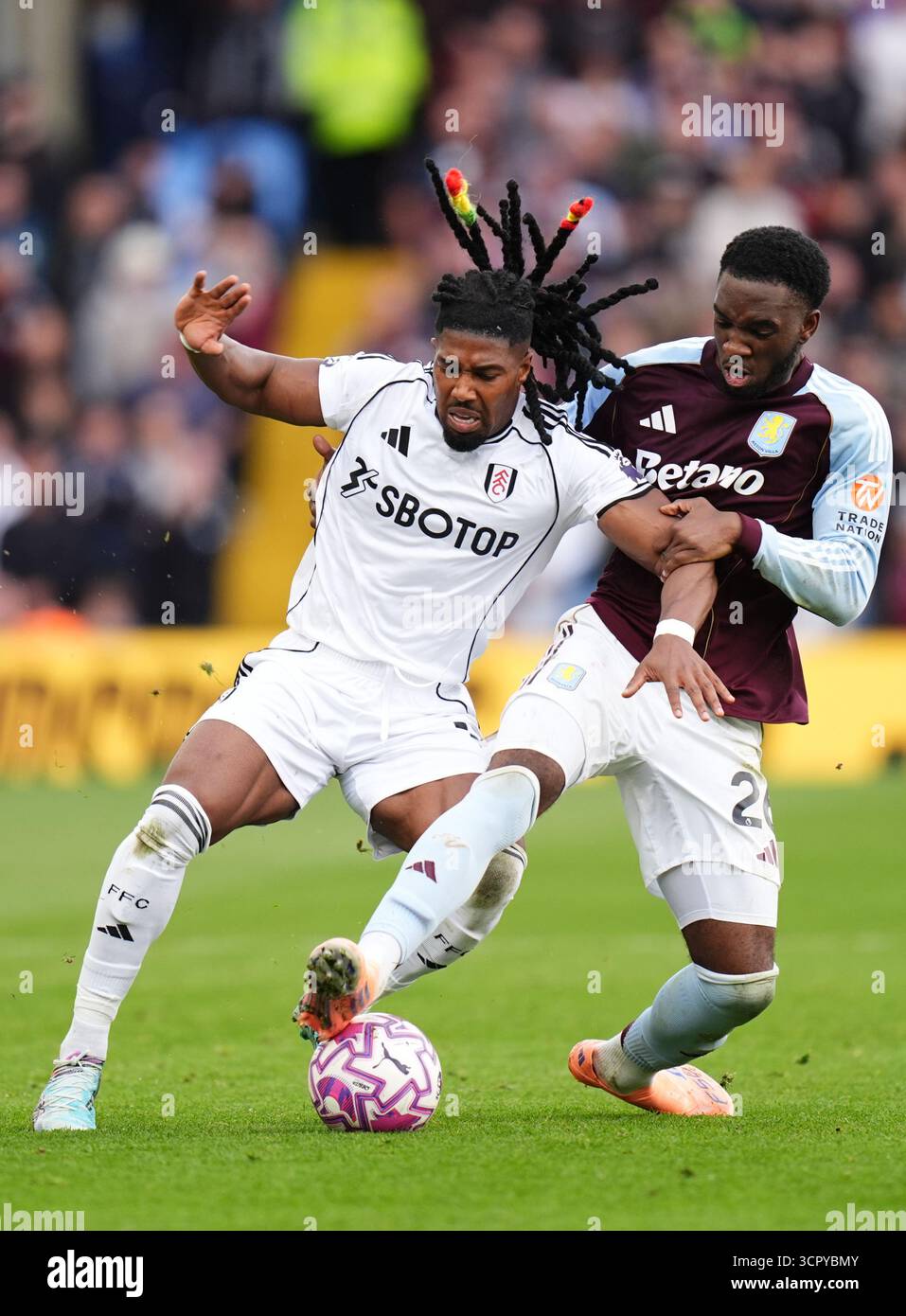Fulham's Adama Traore (left) and Aston Villa's Lamare Bogarde battle ...