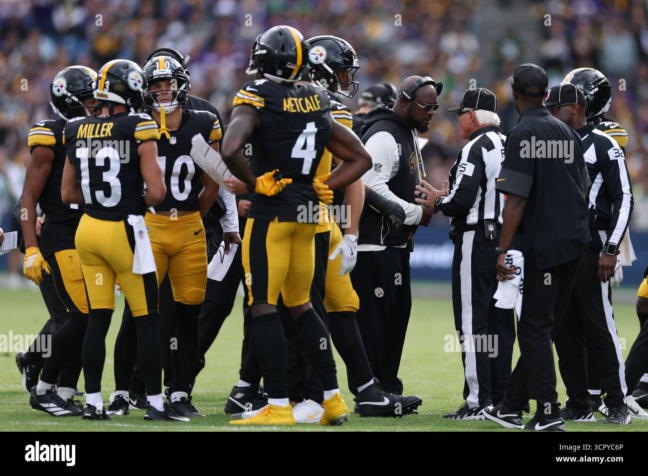 Pittsburgh Steelers head coach Mike Tomlin, center right, speaks to a ...