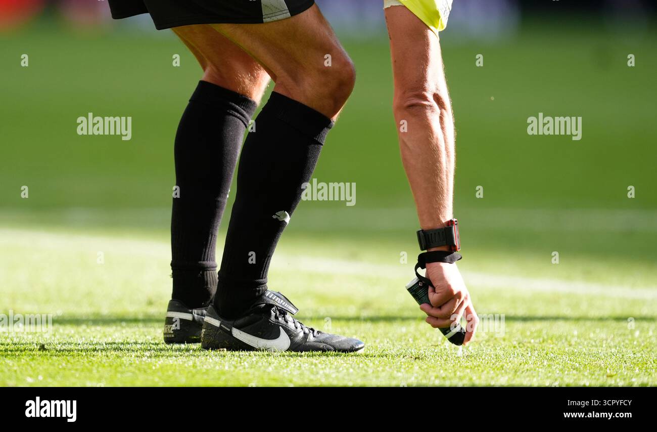Referee uses the spray during the Premier League match at Villa Park ...