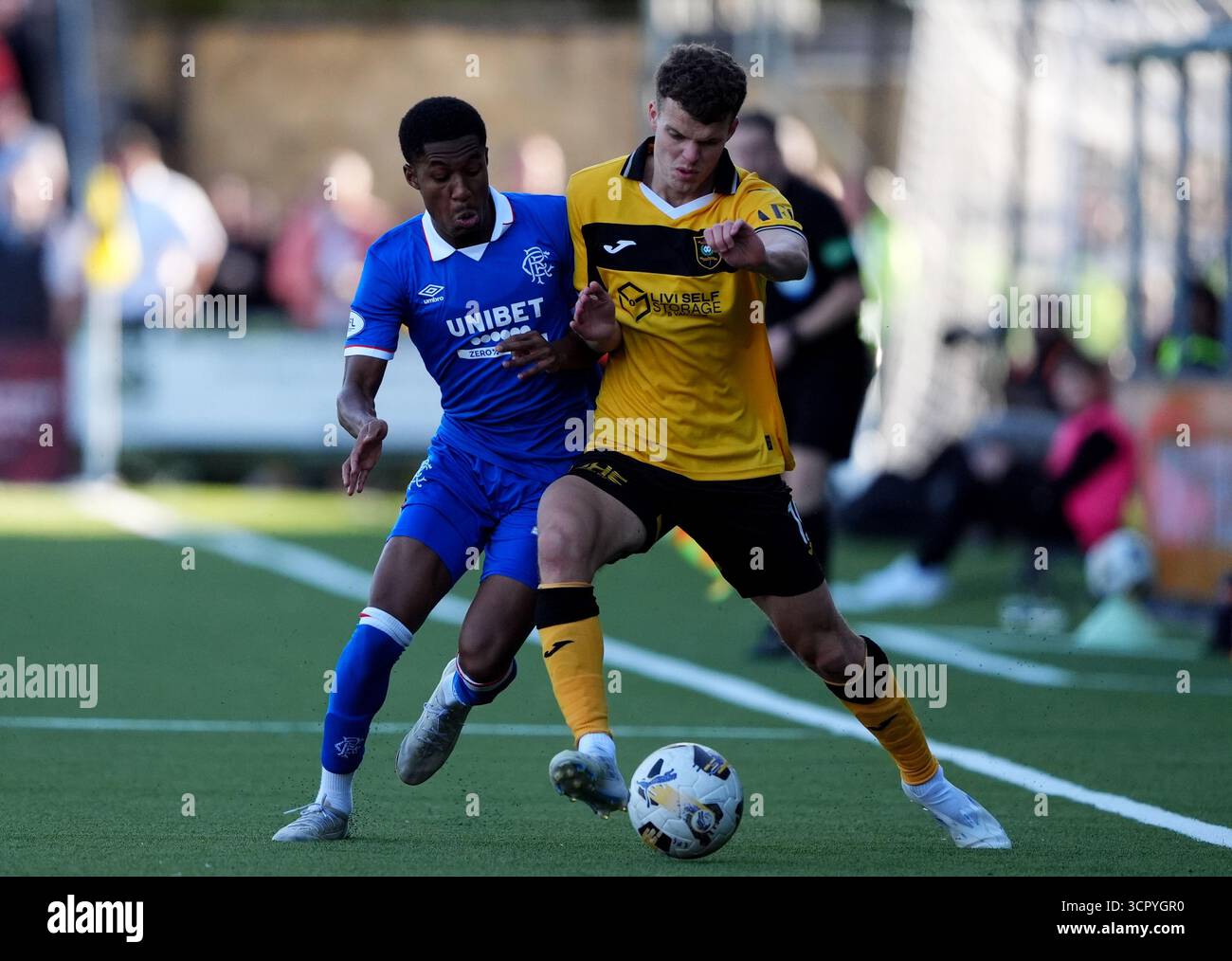 Rangers' Jayden Meghoma (left) and Livingston's Lewis Smith battle for ...