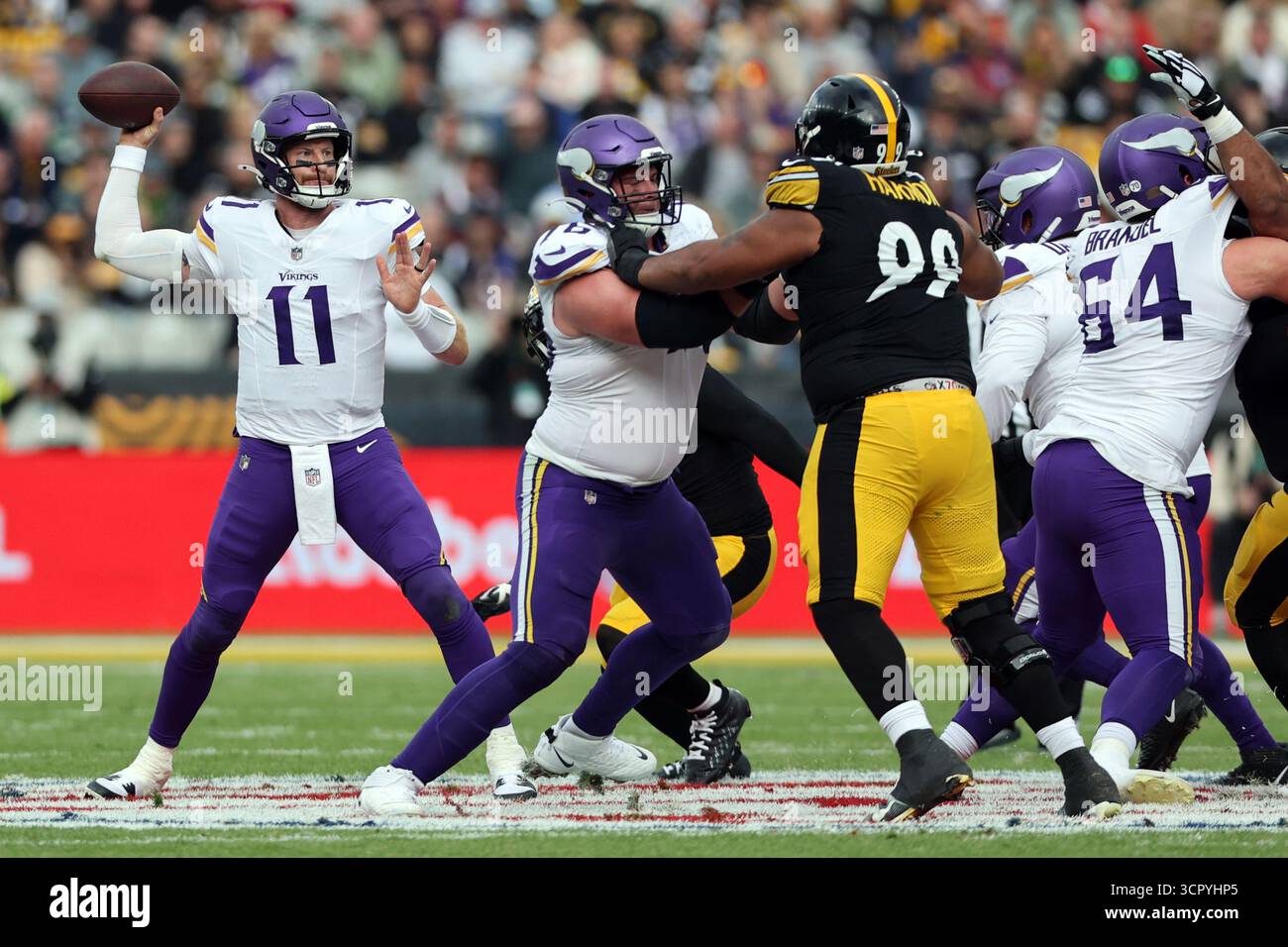 Minnesota Vikings quarterback Carson Wentz (11) passes as he is ...