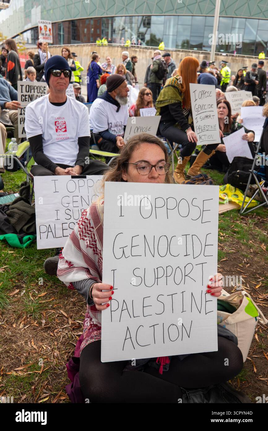 Palestine Action protesters sat with placards and were arrested and ...