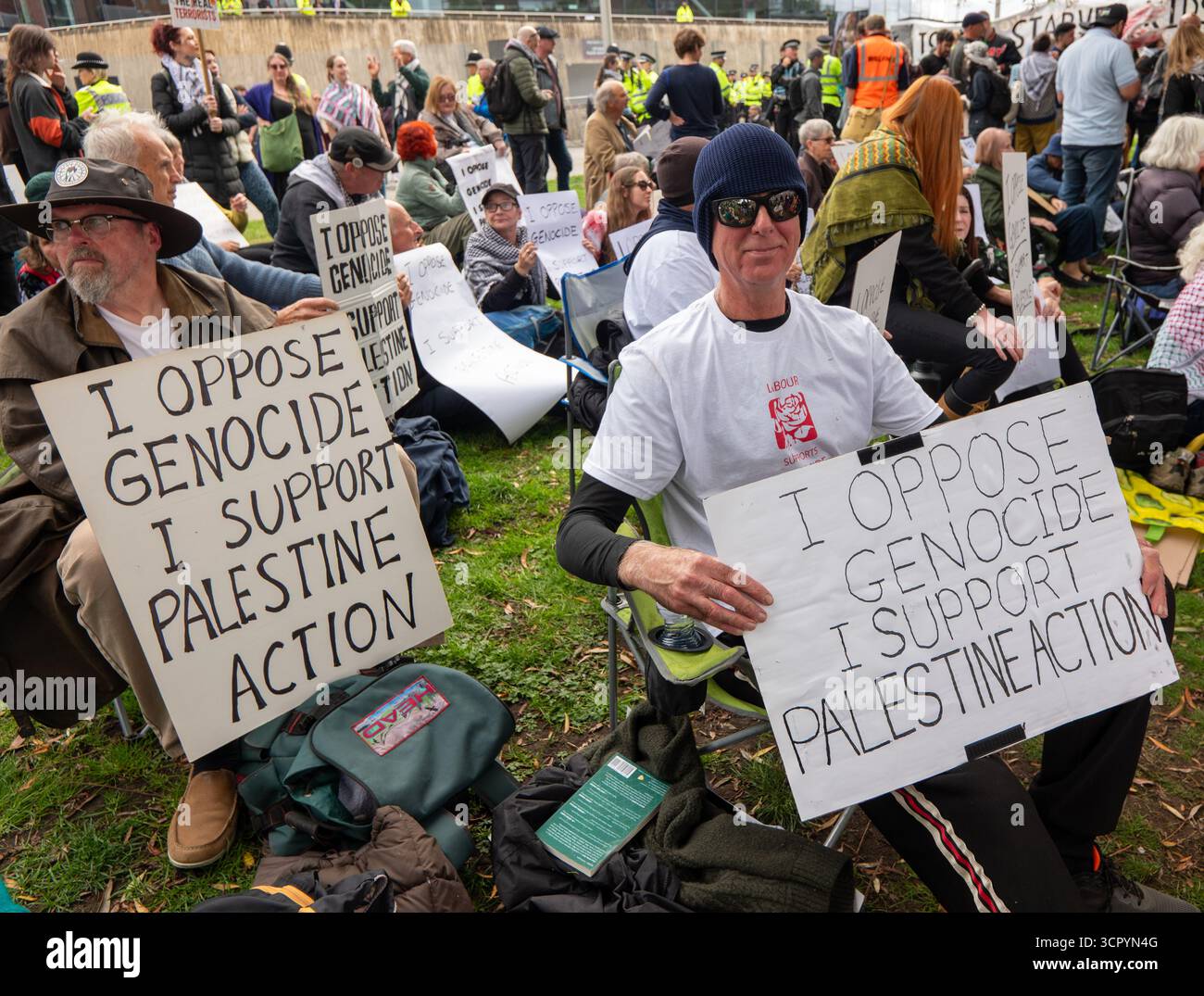 Palestine Action protesters sat with placards and were arrested and ...
