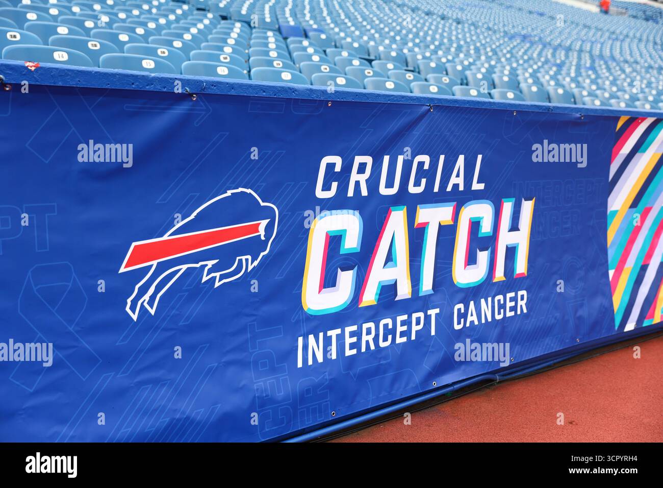 A crucial catch banner lines the stands before an NFL football game ...