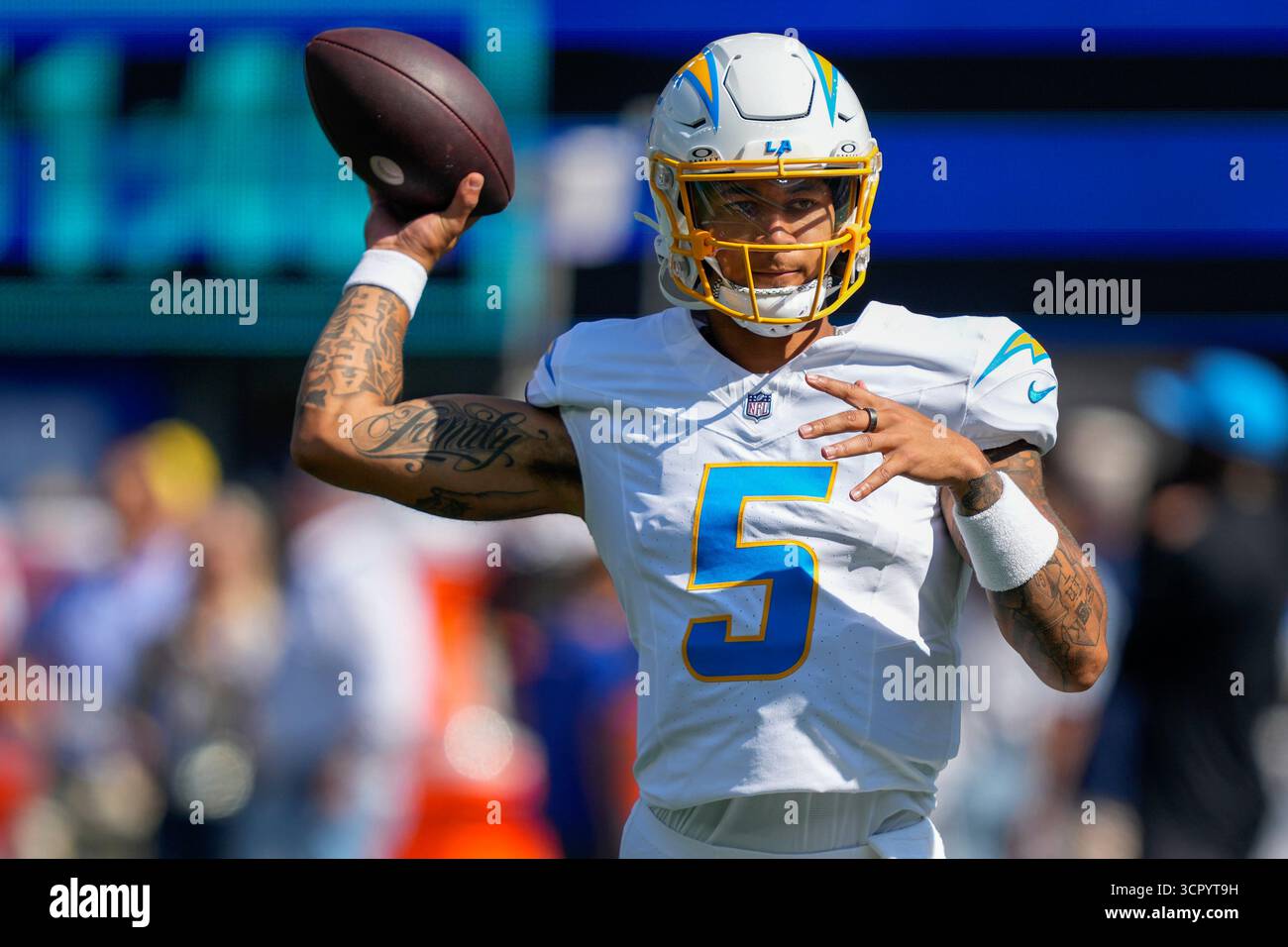 Los Angeles Chargers quarterback Trey Lance (5) warms up before playing ...
