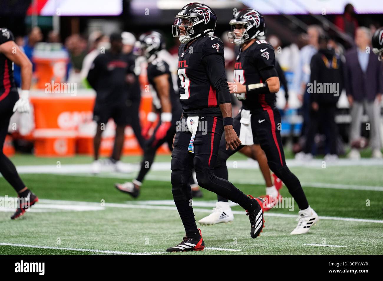 Atlanta Falcons quarterbacks Michael Penix Jr. (9) and Kirk Cousins ...
