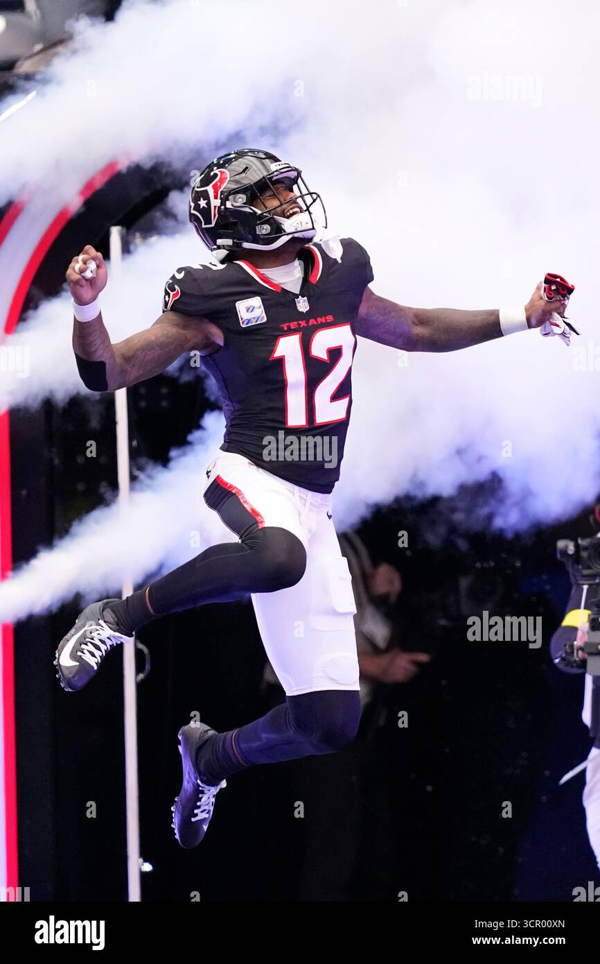 Houston Texans wide receiver Nico Collins (12) leaps into the air as he ...