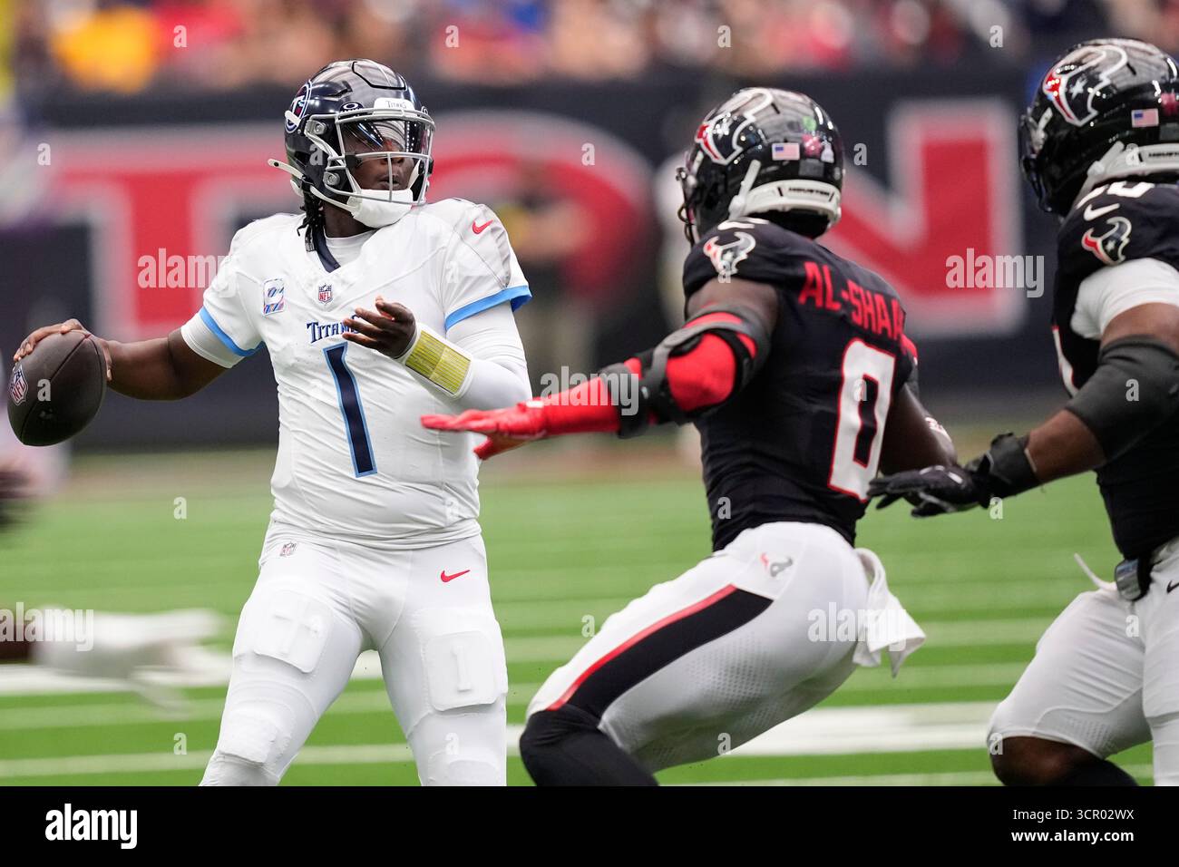 Tennessee Titans quarterback Cam Ward (1) is pressured by Houston ...