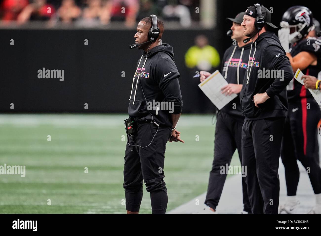 Atlanta Falcons head coach Raheem Morris, left, watches during the ...