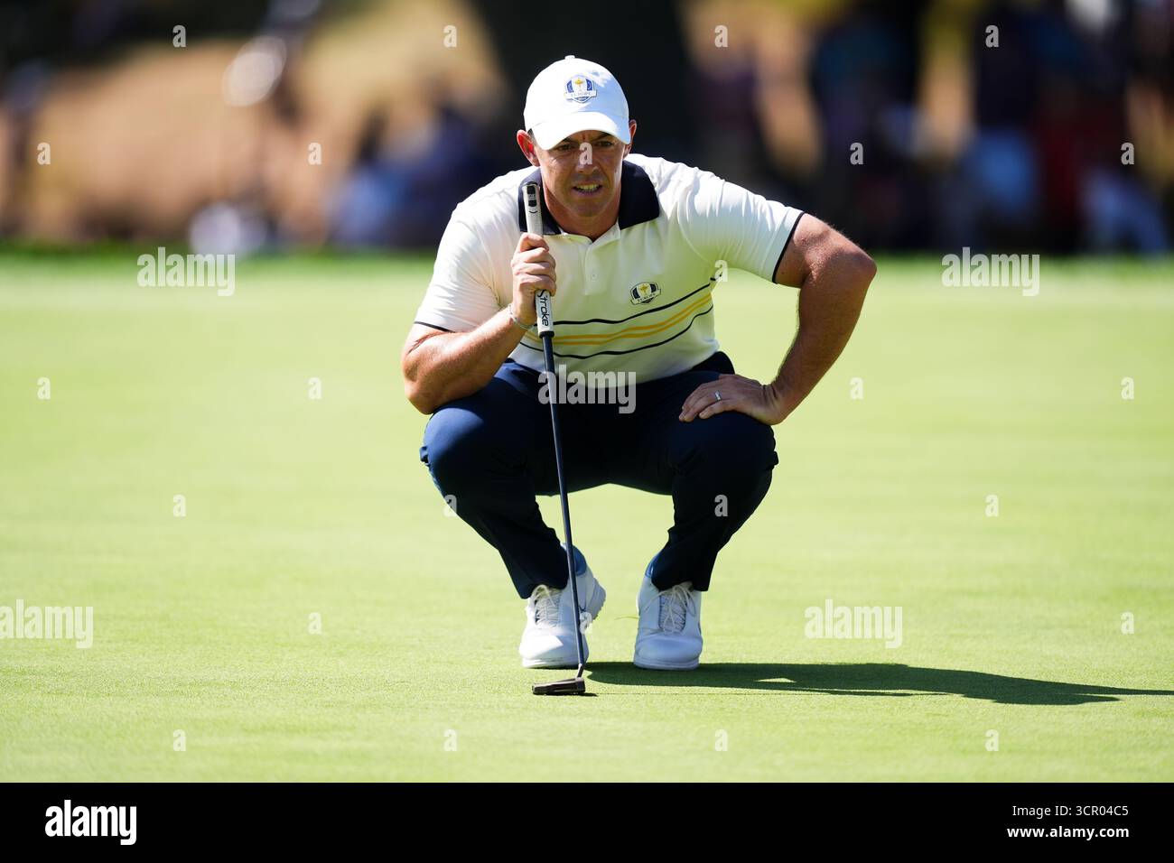 Rory McIlroy of Team Europe lines up a put during the Sunday singles ...