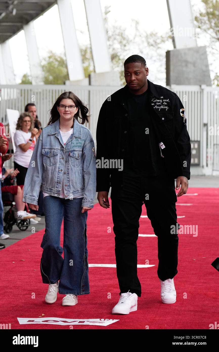 San Francisco 49ers defensive tackle Alfred Collins, right, arrives ...
