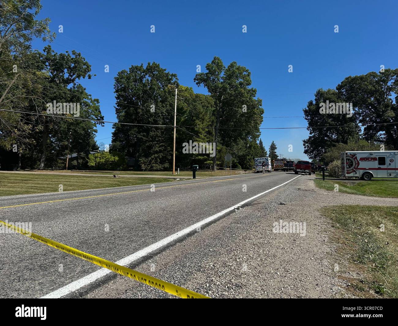 A road is blocked by authorities after a gunman opened fire inside a ...