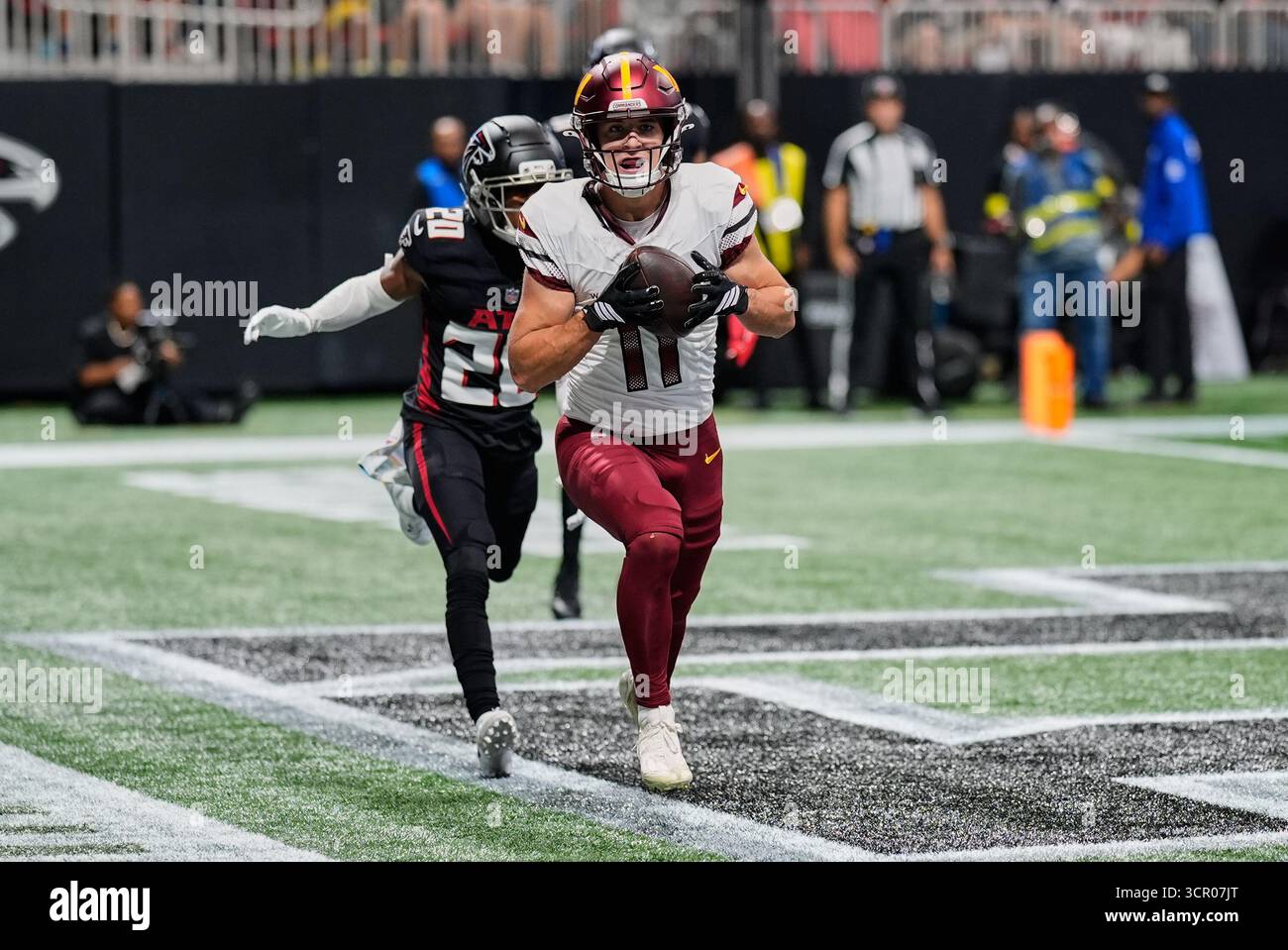 Washington Commanders wide receiver Luke McCaffrey (11) scores a ...