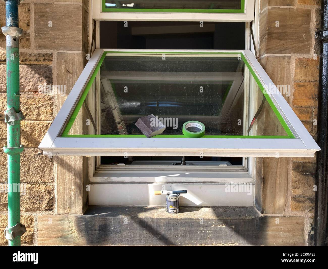 Painting exterior windows smartphone stock photos and images - Alamy