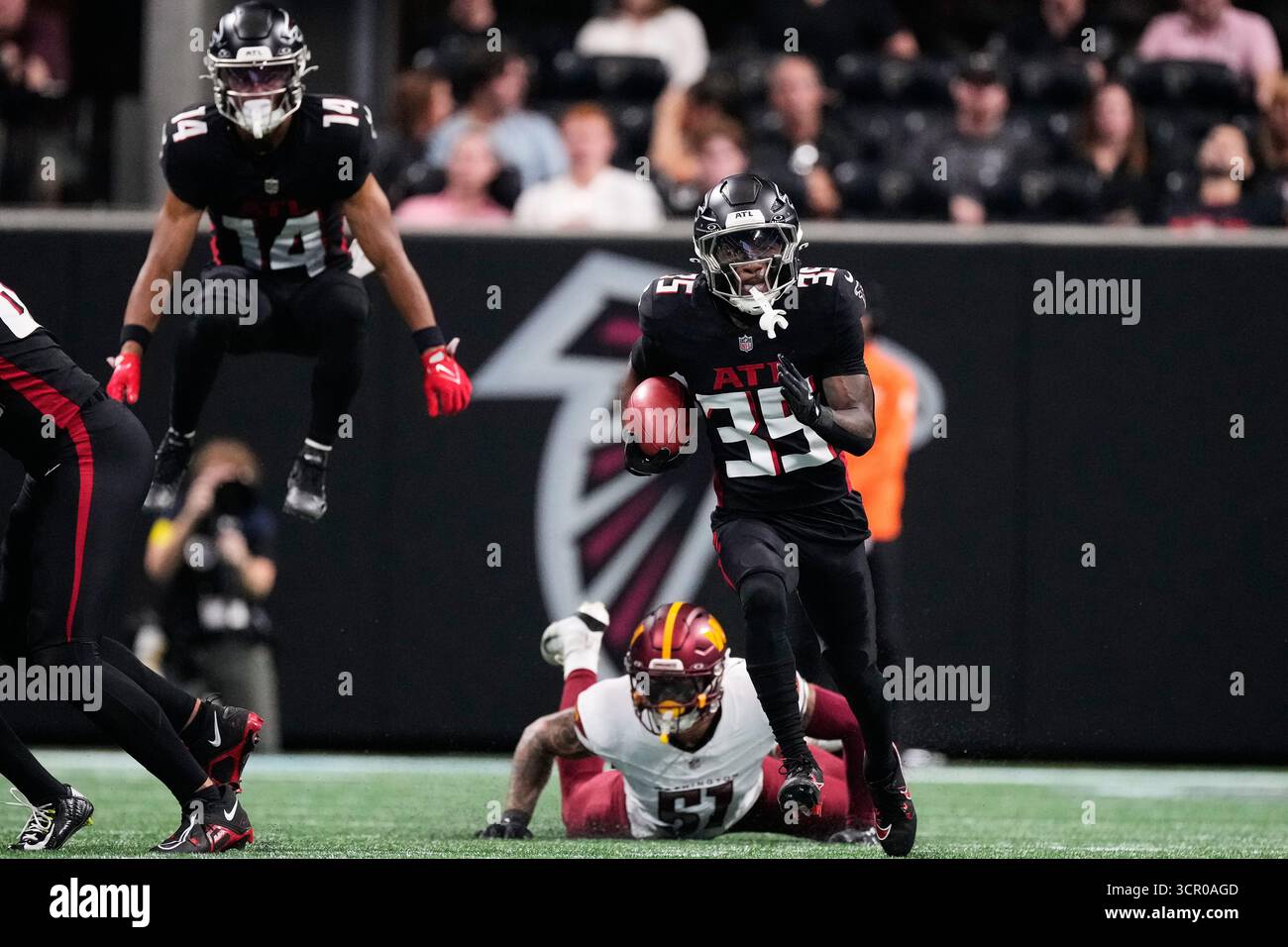 Atlanta Falcons cornerback Natrone Brooks (35) runs the ball past ...