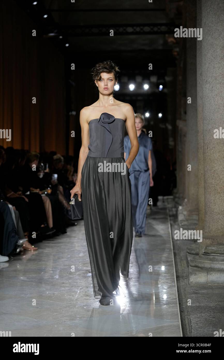 A model wears a creation as part of the Giorgio Armani Spring/Summer 2026 collection show in ...