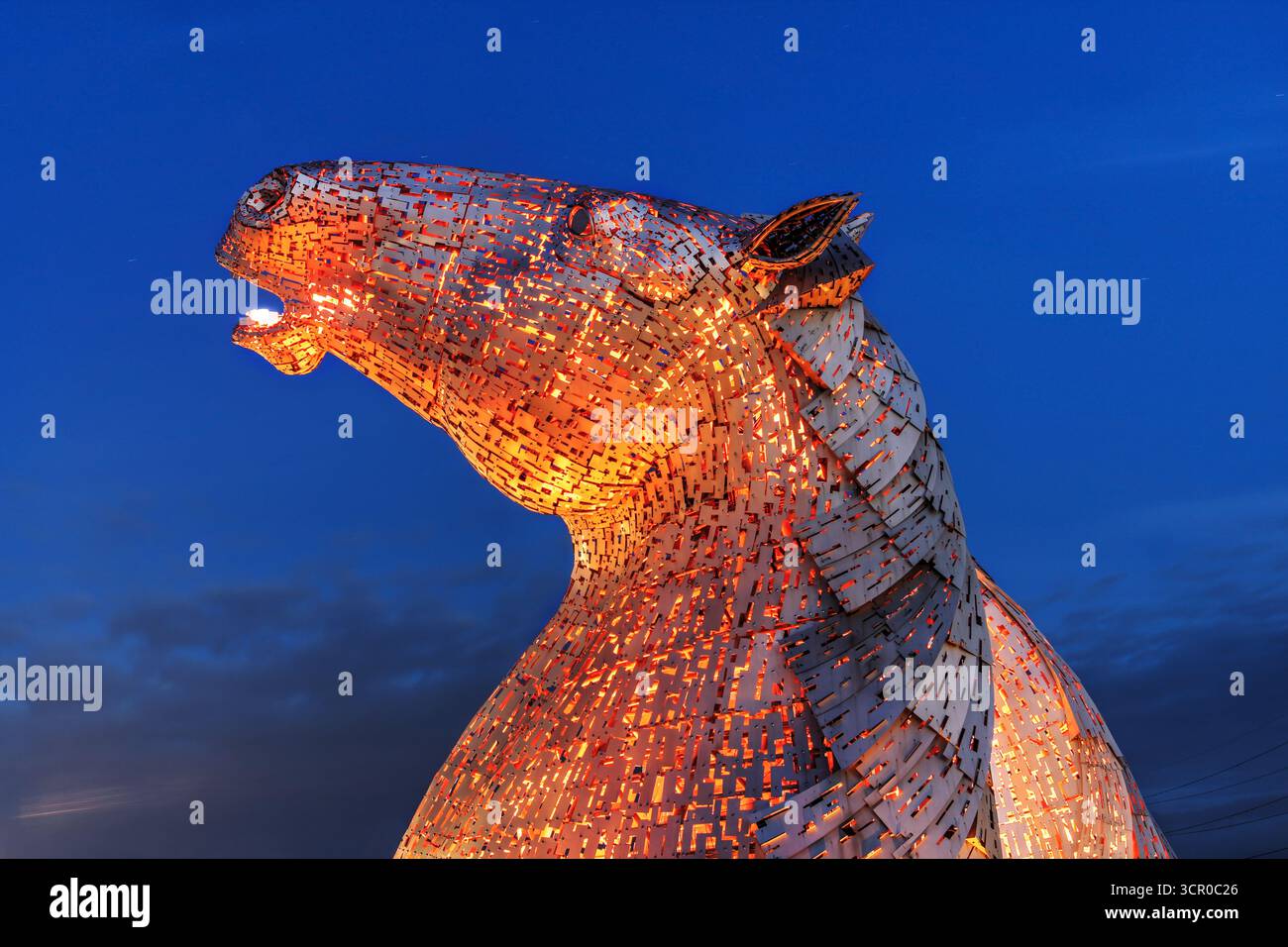 Detail at night of the monumental horse sculptures known as The Kelpies ...