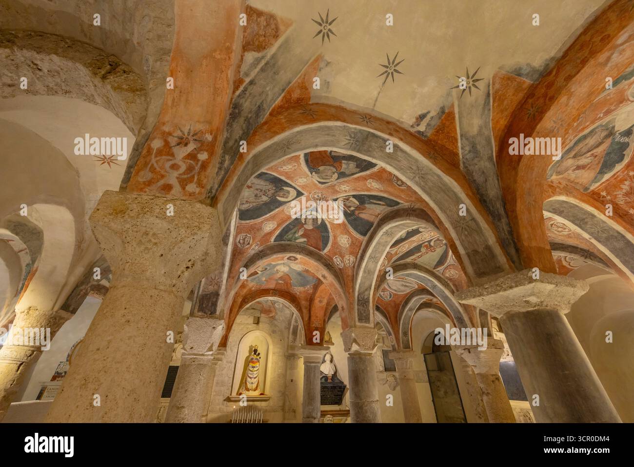 Vaulted ceiling frescoes and stone pillars showcasing medieval ...