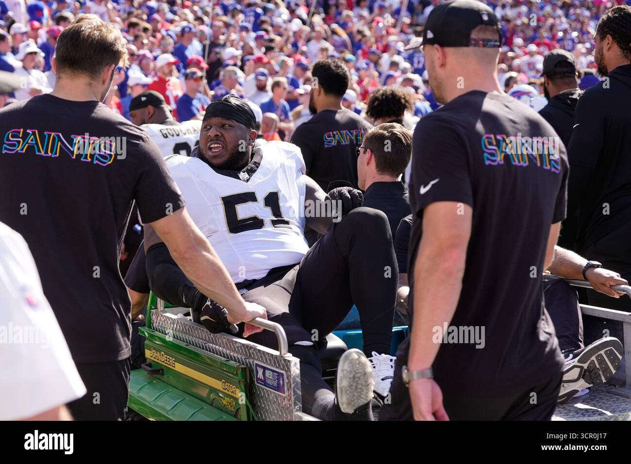 New Orleans Saints center Cesar Ruiz (51) is carted off the field after ...