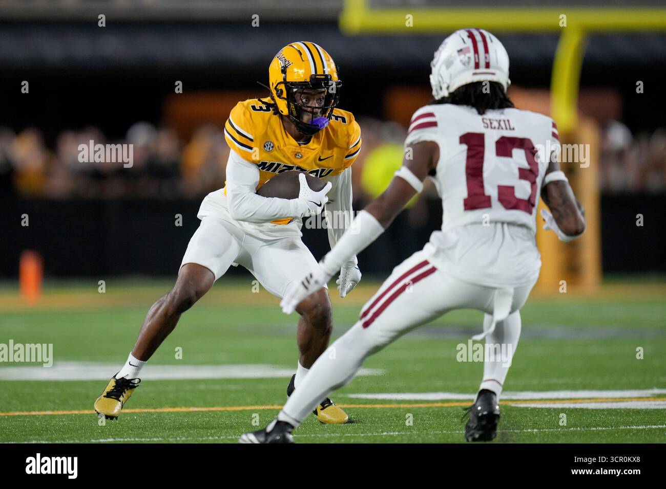 Missouri wide receiver Kevin Coleman Jr., left, runs with the ball as ...