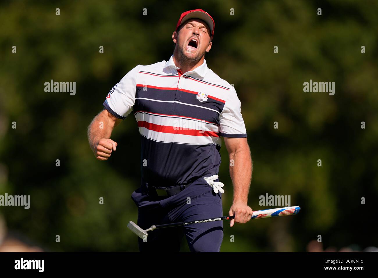 United States' Bryson DeChambeau celebrates after a putt on the 12th ...