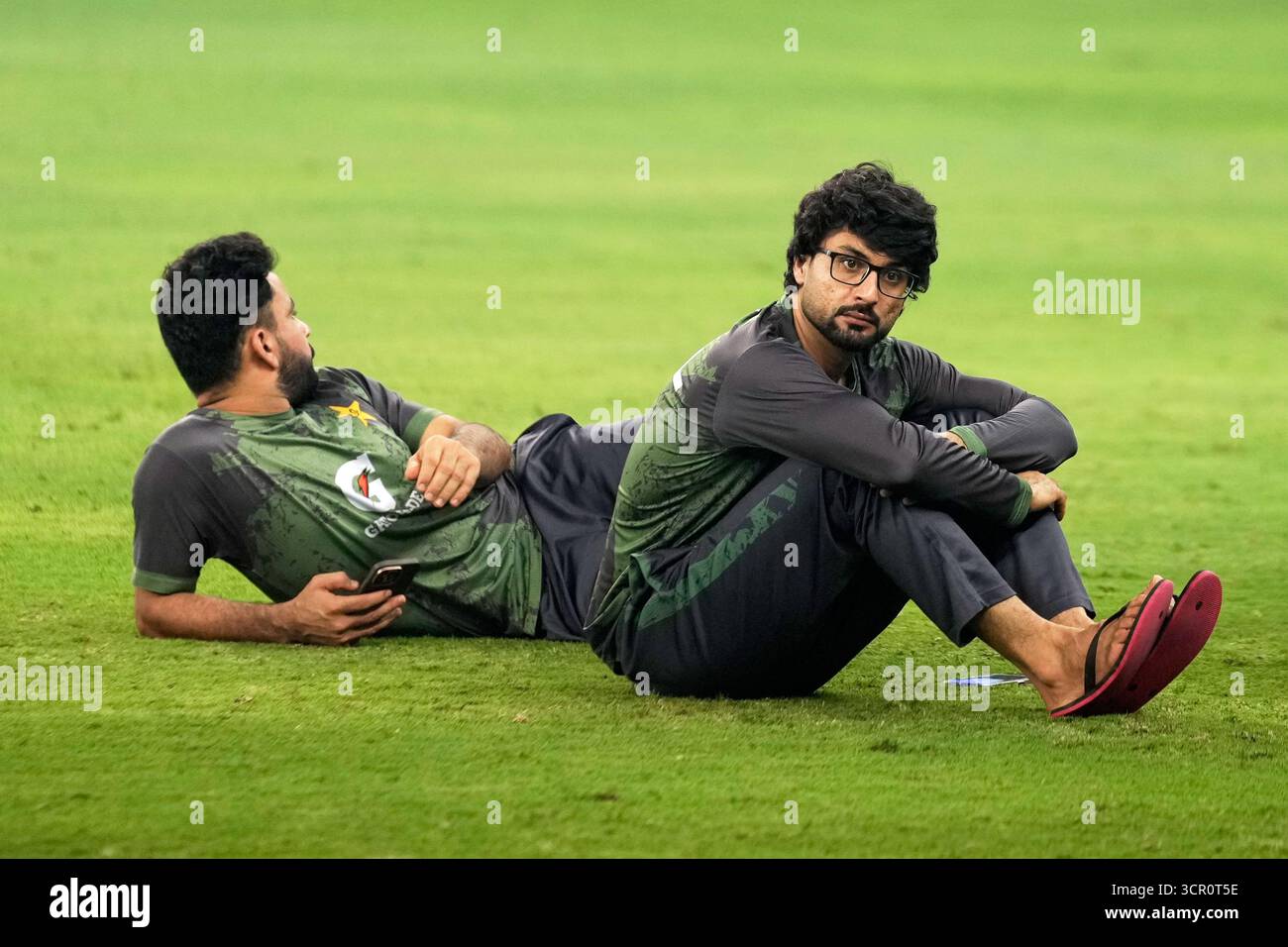 Pakistan's Abrar Ahmed, right, waits for the presentation ceremony after India won the Asia Cup ...