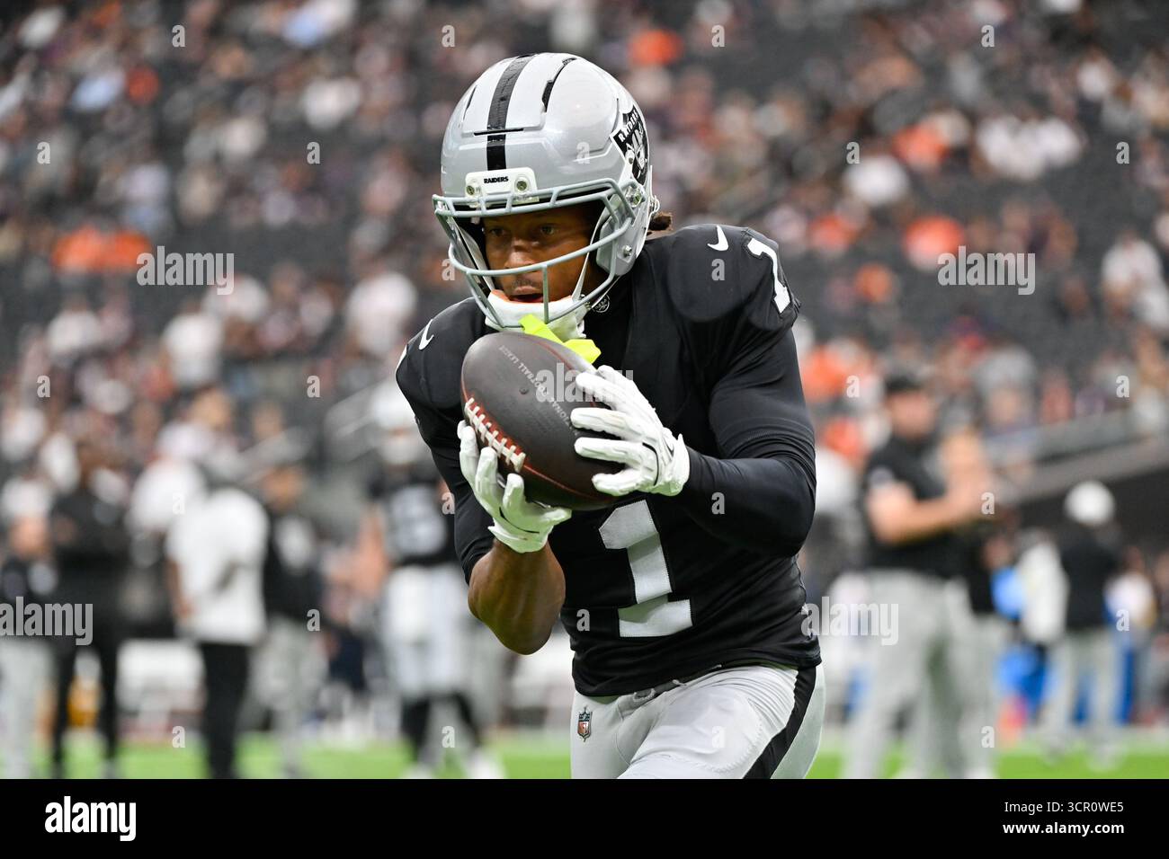 Las Vegas Raiders wide receiver Tre Tucker (1) warms up before the team ...