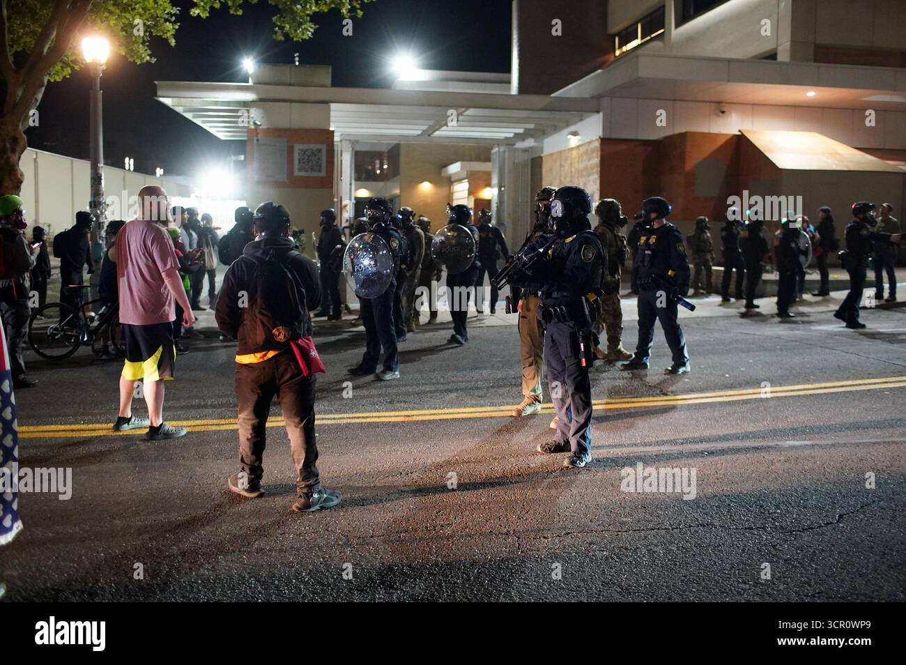 People protest outside the Portland ICE facility, Saturday, Sept. 27 ...