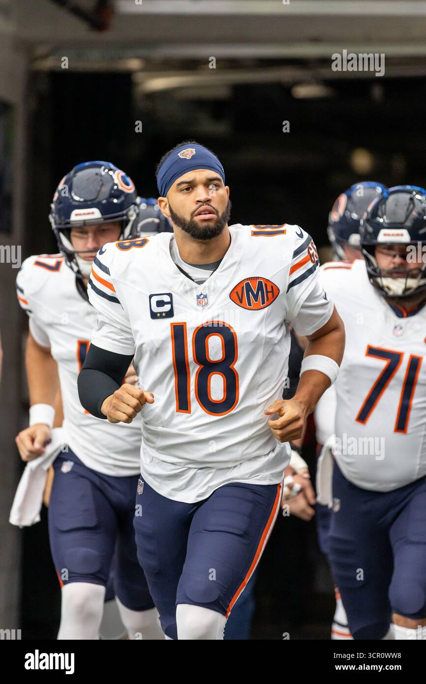 Chicago Bears quarterback Caleb Williams (18) enters the field to warm ...