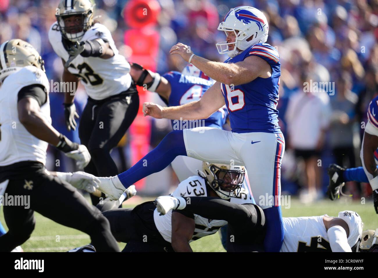 Buffalo Bills punter Cameron Johnston (16) is hit in the leg by New ...