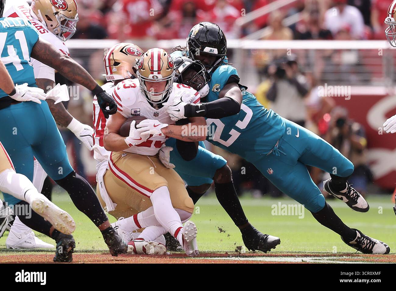 San Francisco 49ers running back Christian McCaffrey, middle, runs ...