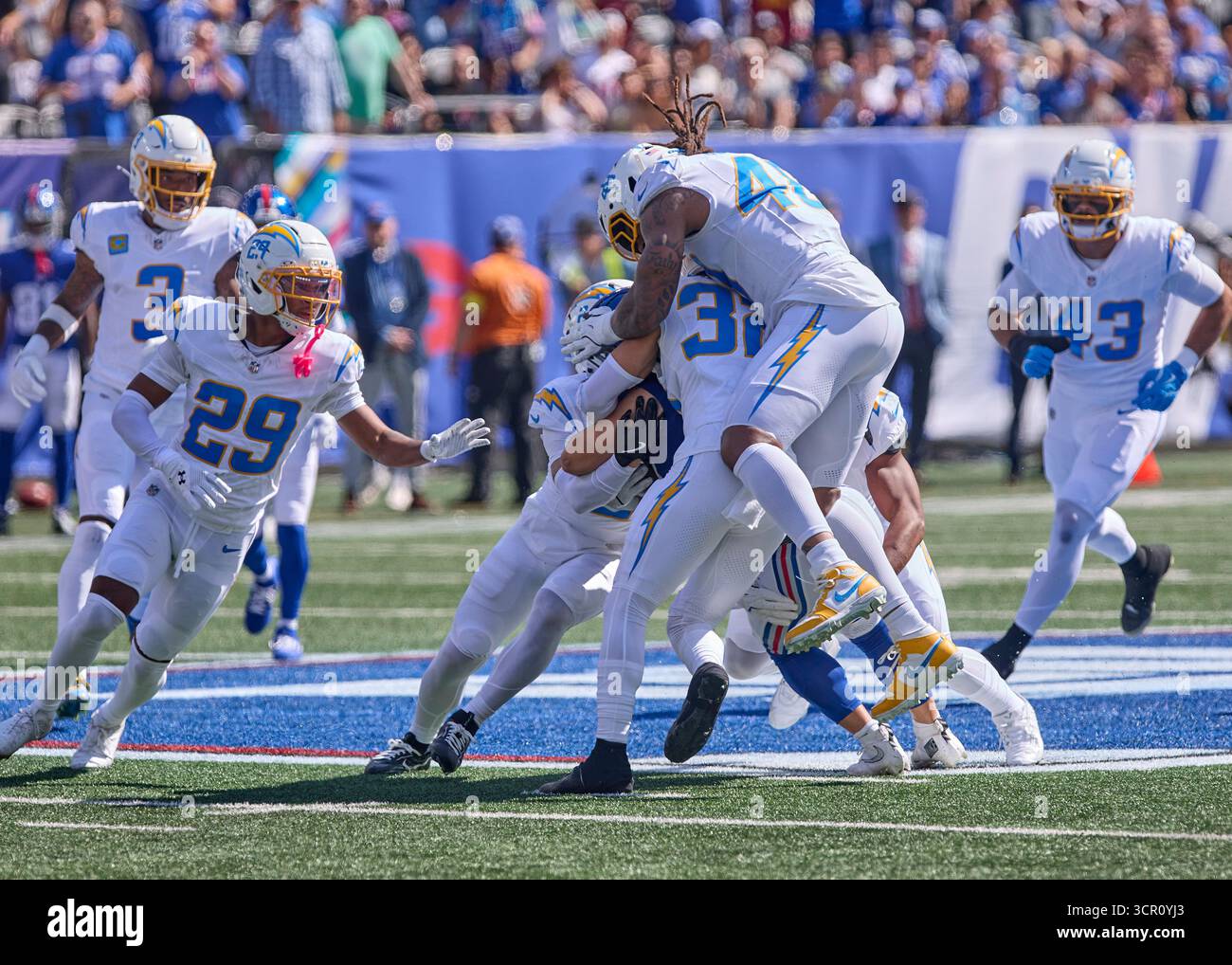 New York Giants running back Cam Skattebo (44) is ganged tackled by the ...